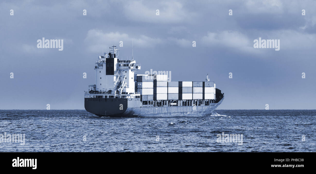 cargo ship in the ocean Stock Photo - Alamy