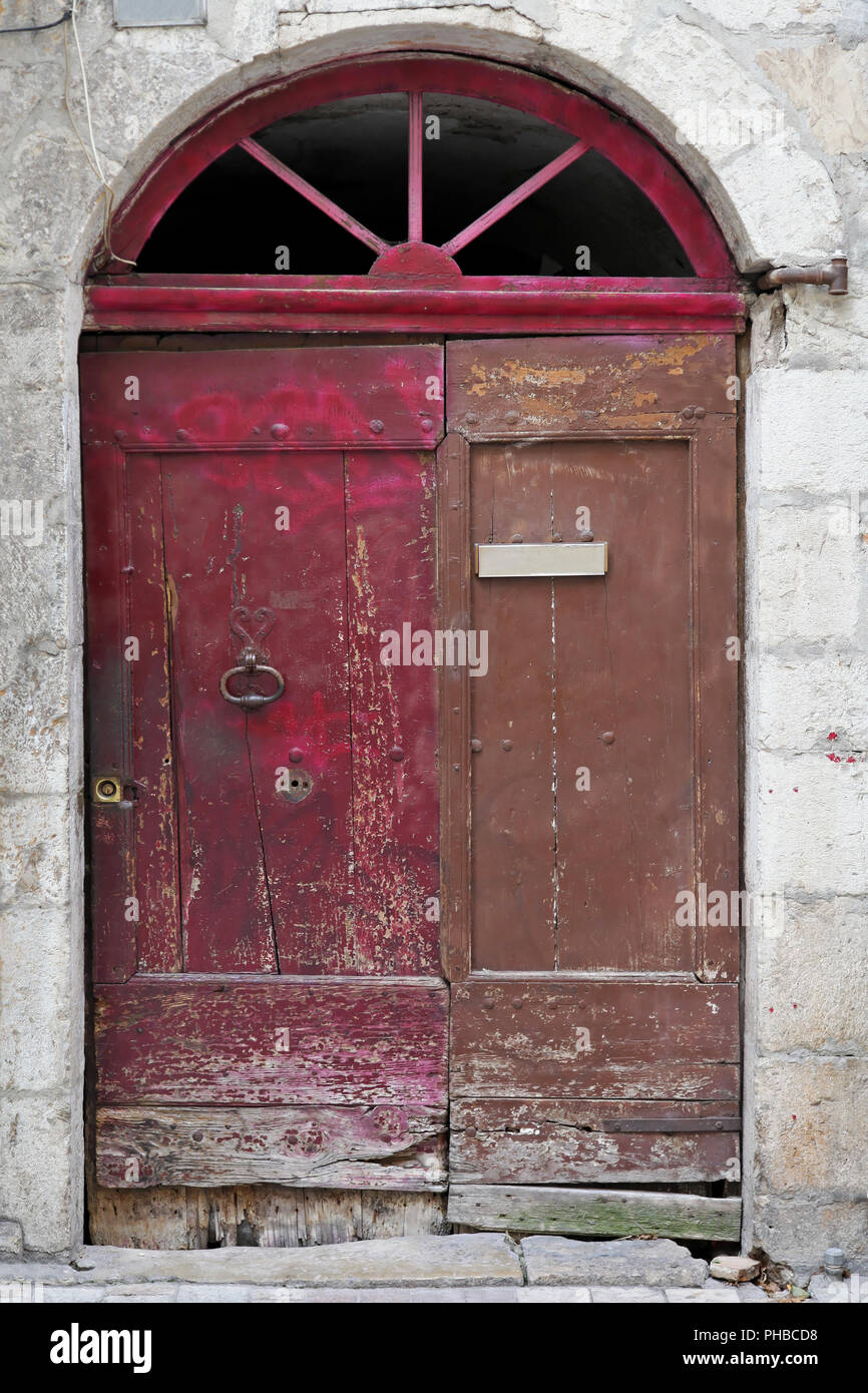 Wooden door with arch at derelict house Stock Photo - Alamy