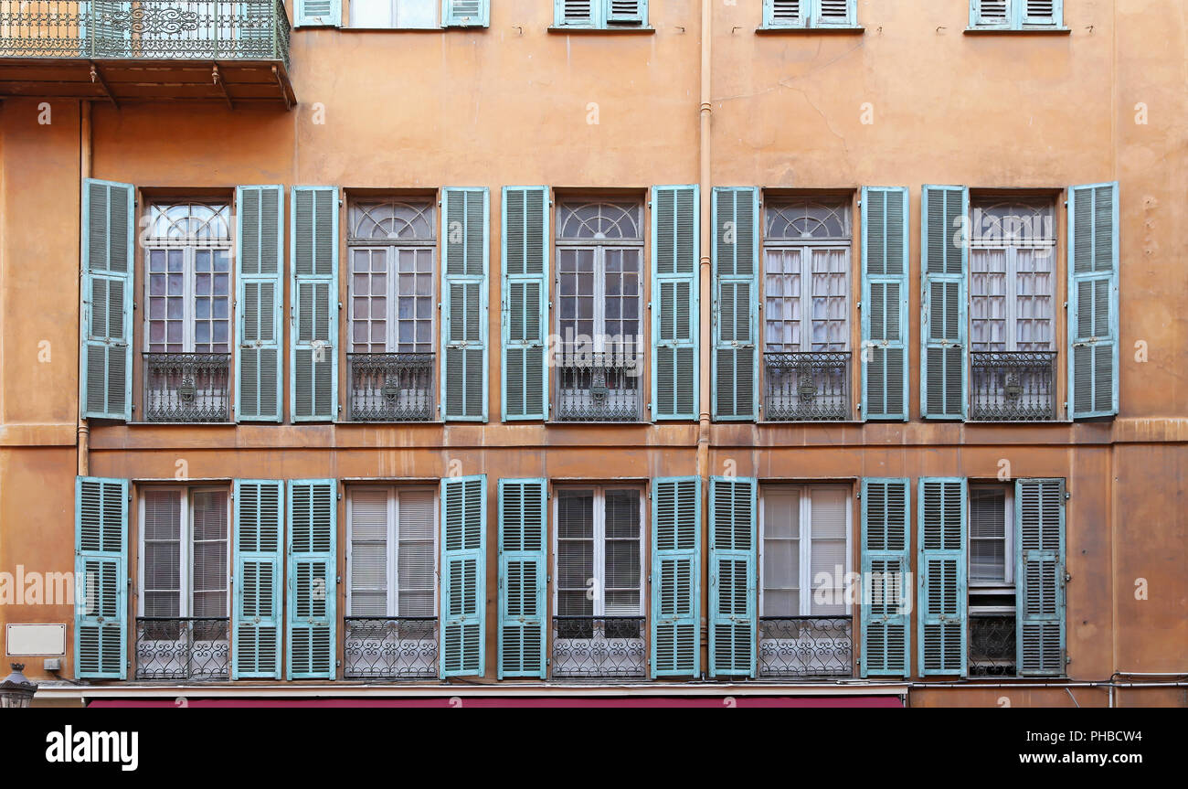 Classic style french balconies with big windows Stock Photo - Alamy
