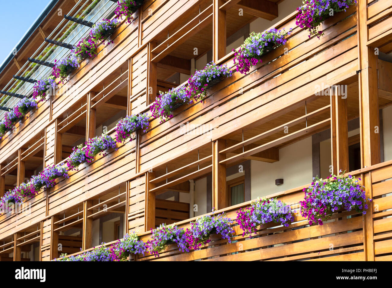 Flowers on Chalet balcony Stock Photo - Alamy