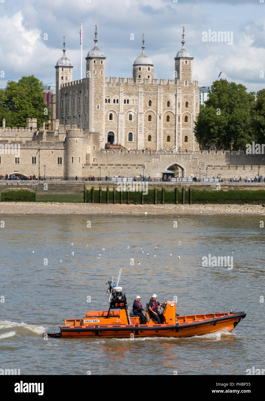 the RNLI river Thames lifeboat in front of the tower of London Stock ...