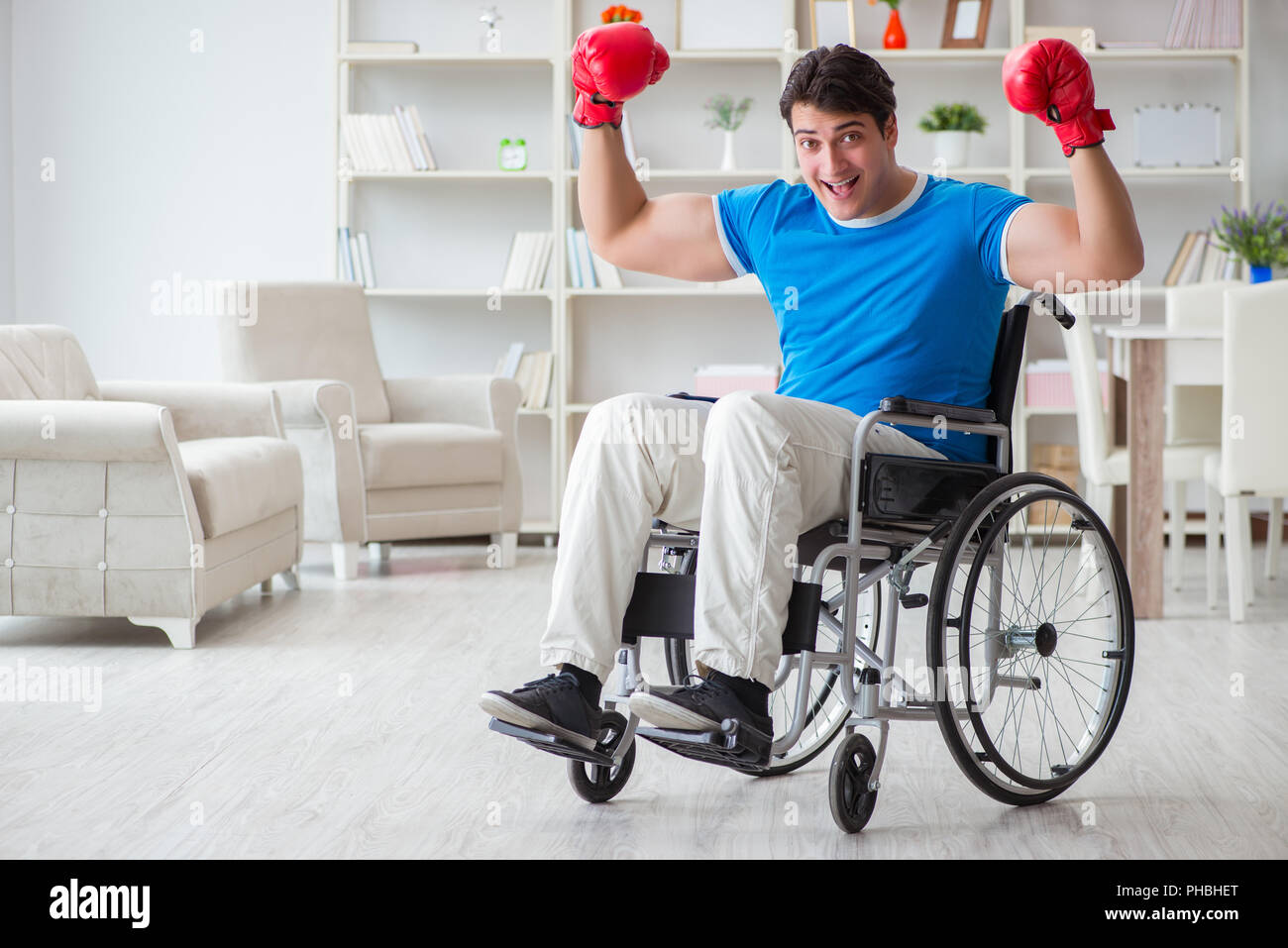 Disabled boxer at wheelchair recovering from injury Stock Photo - Alamy
