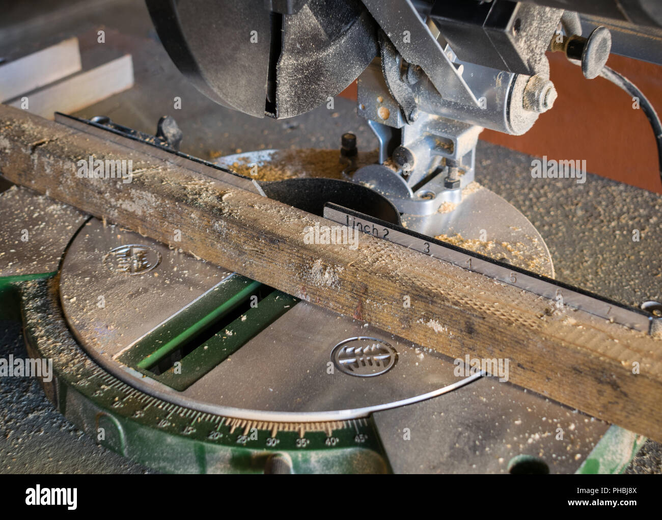 Circular saw cutting wood with sawdust Stock Photo - Alamy