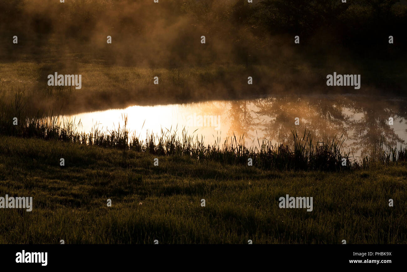 fog and smoke coming from the lake during the temperature drop, early ...