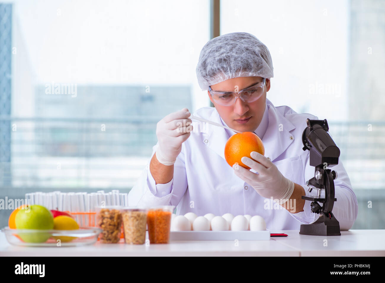 Nutrition expert testing food products in lab Stock Photo - Alamy