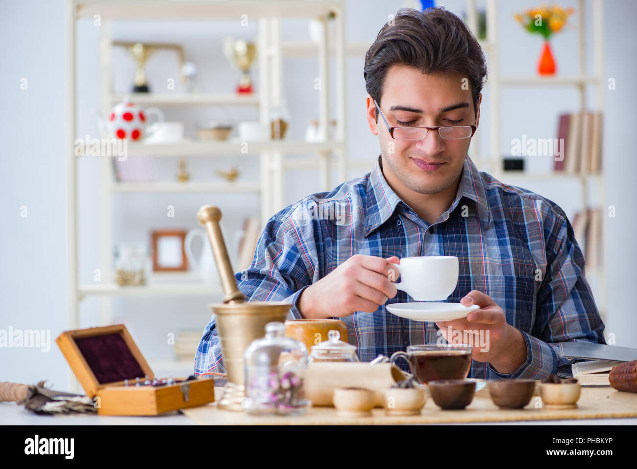 Tea expert brewing cup of drink hi-res stock photography and images - Alamy