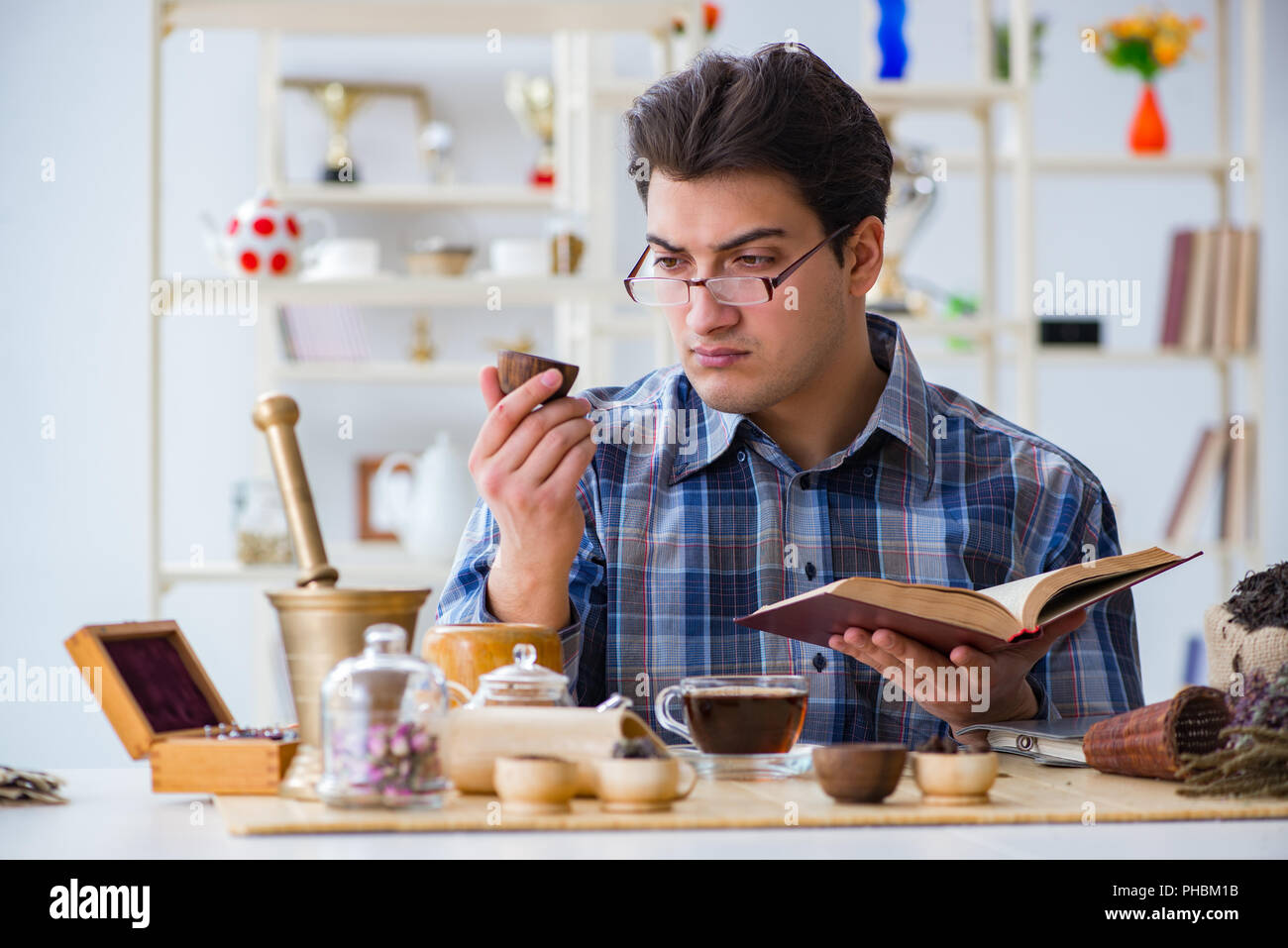 Tea expert brewing cup of drink hi-res stock photography and images - Alamy