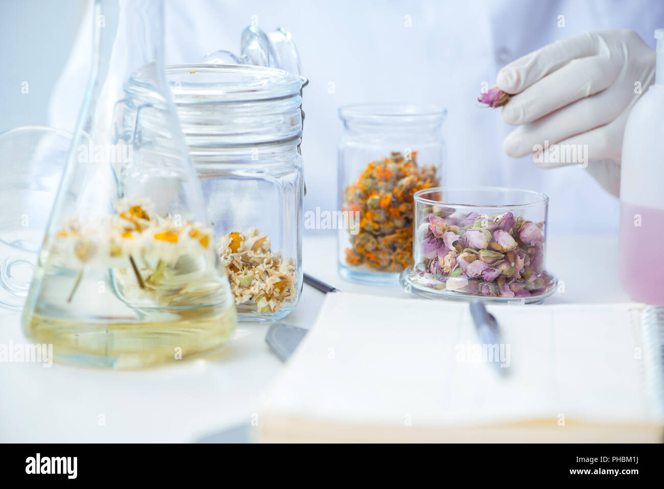 Chemist mixing perfumes in the lab Stock Photo - Alamy