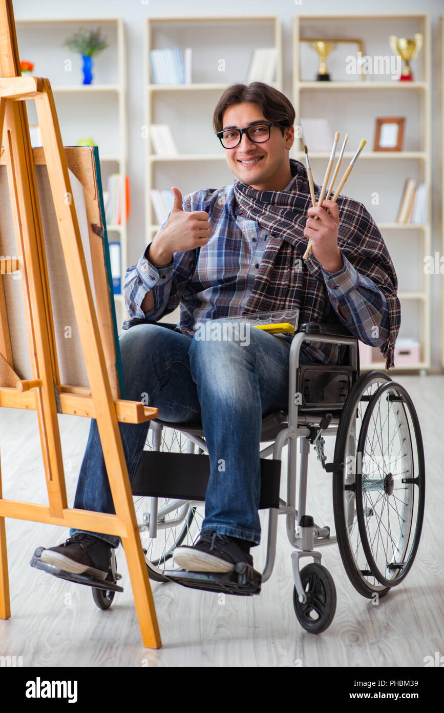 Disabled artist painting picture in studio Stock Photo - Alamy
