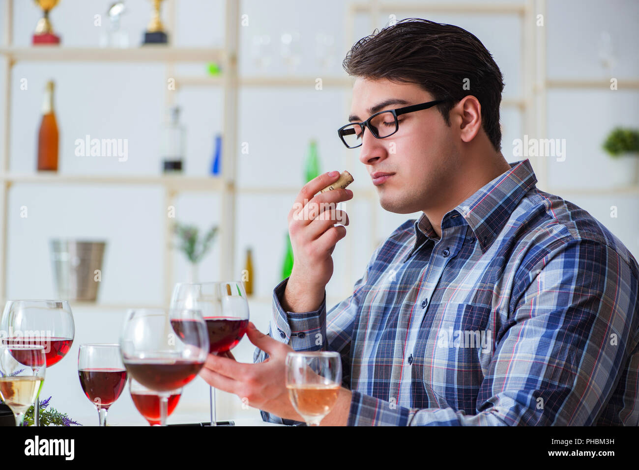 Professional sommelier tasting red wine Stock Photo - Alamy