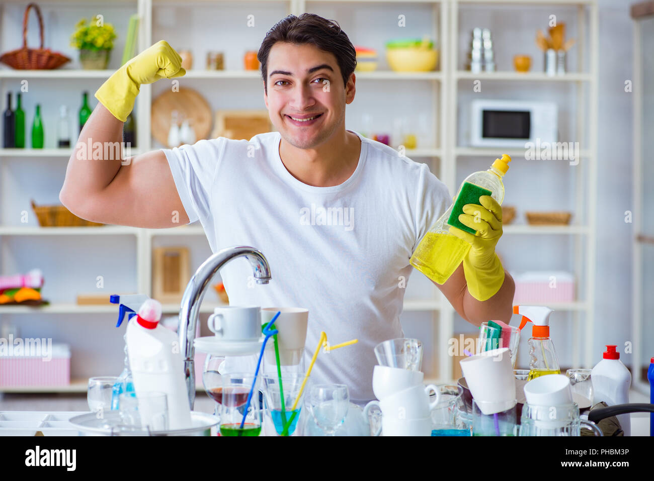 Good husband washing dishes at home Stock Photo - Alamy