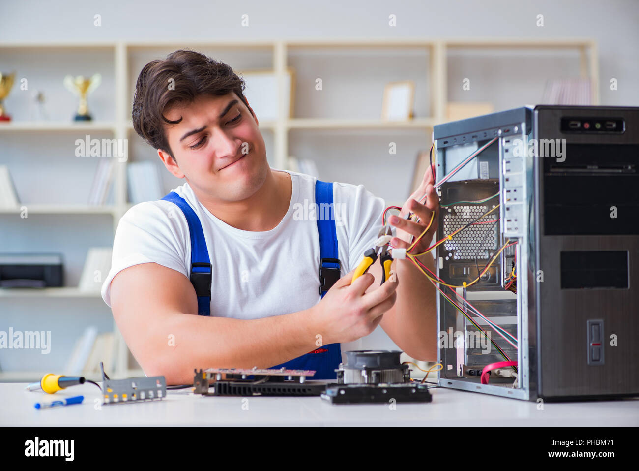 Computer repairman repairing desktop computer Stock Photo - Alamy