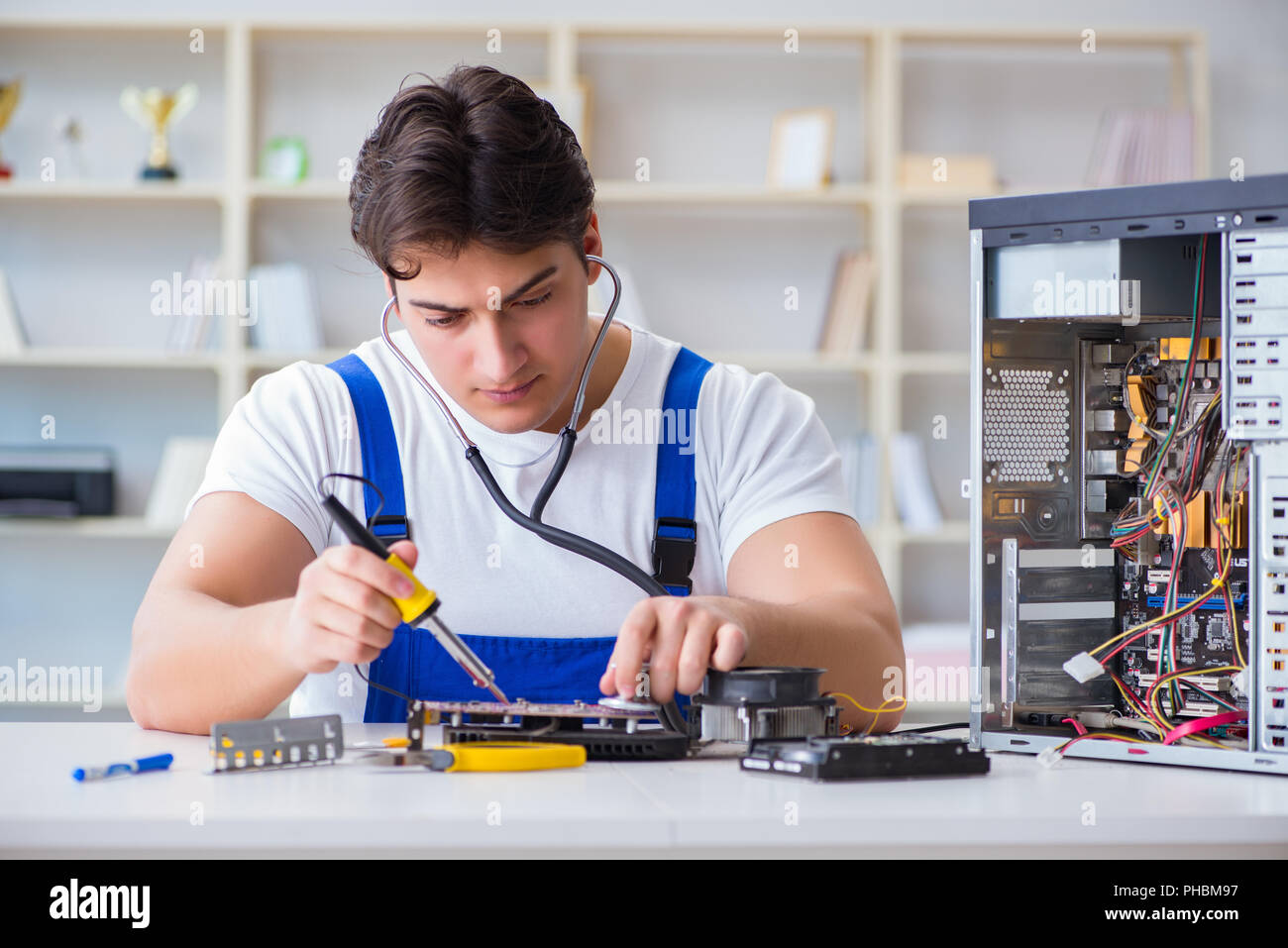 Computer repairman repairing desktop computer Stock Photo - Alamy