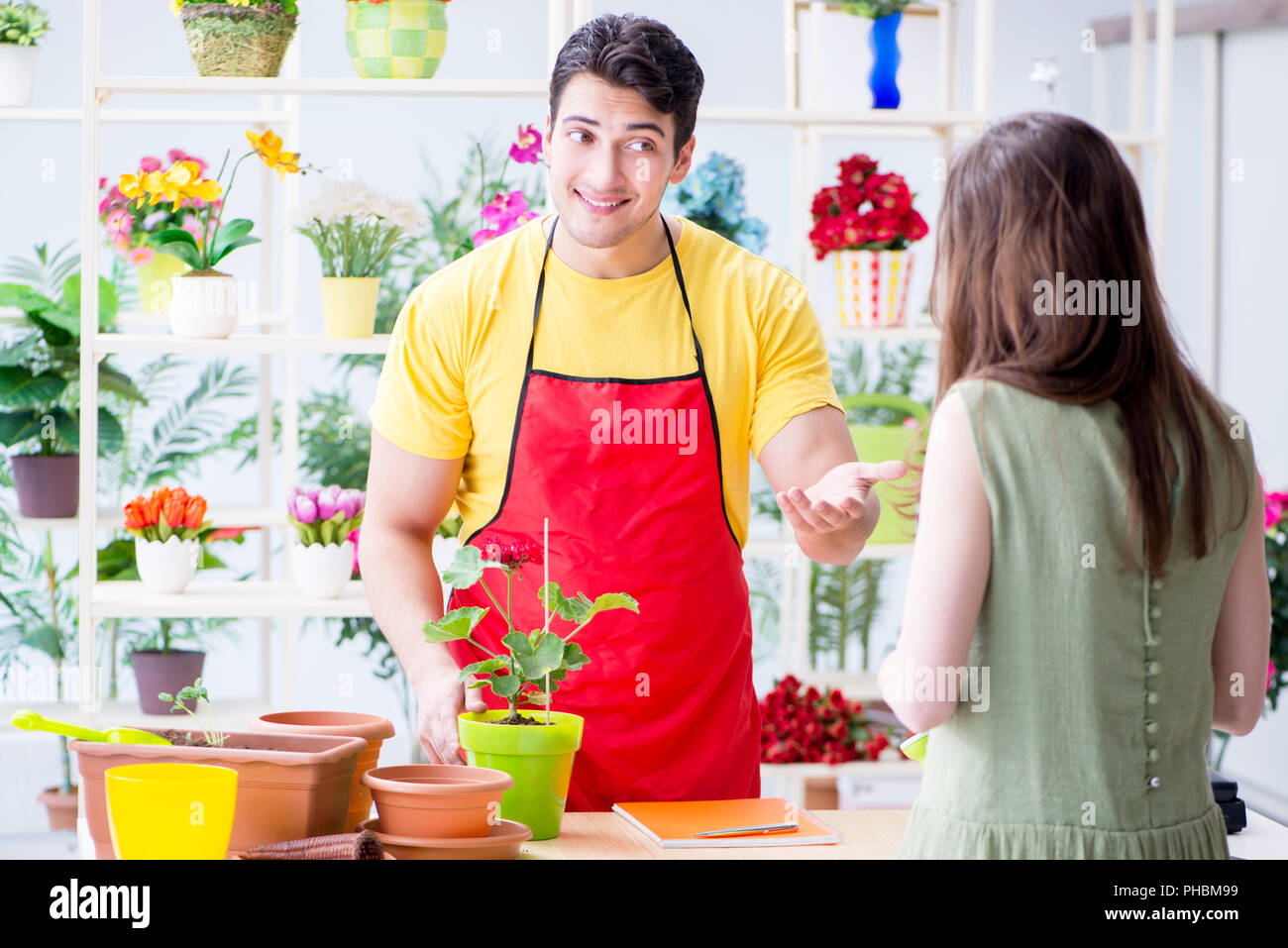 Florist selling flowers in a flower shop Stock Photo - Alamy