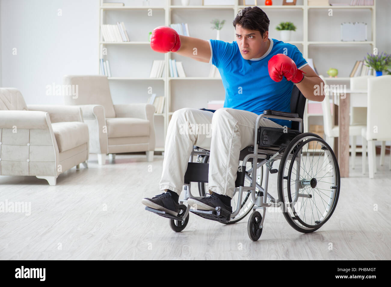 Disabled boxer at wheelchair recovering from injury Stock Photo - Alamy