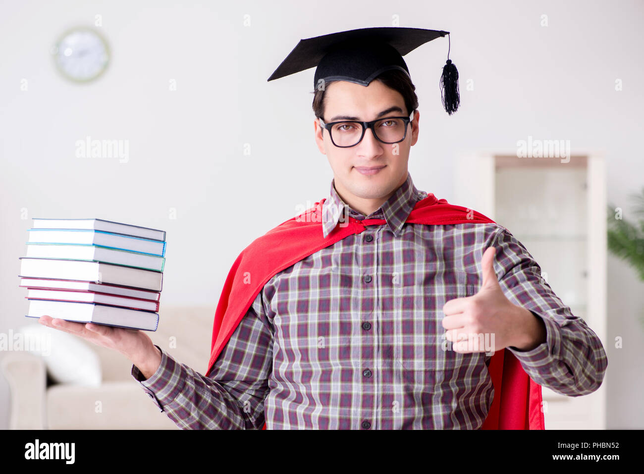 Super hero student with books studying for exams Stock Photo - Alamy