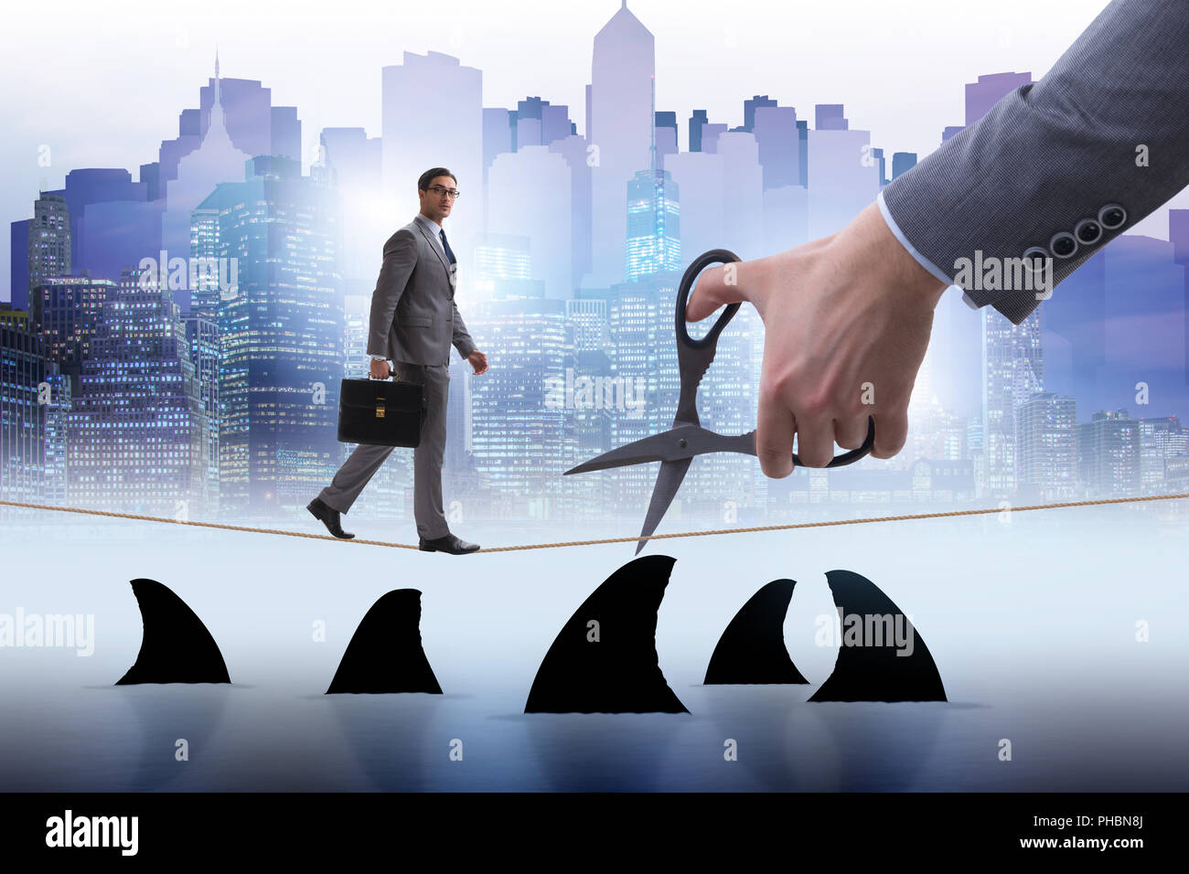 Hand cutting rope in business risk concept Stock Photo - Alamy