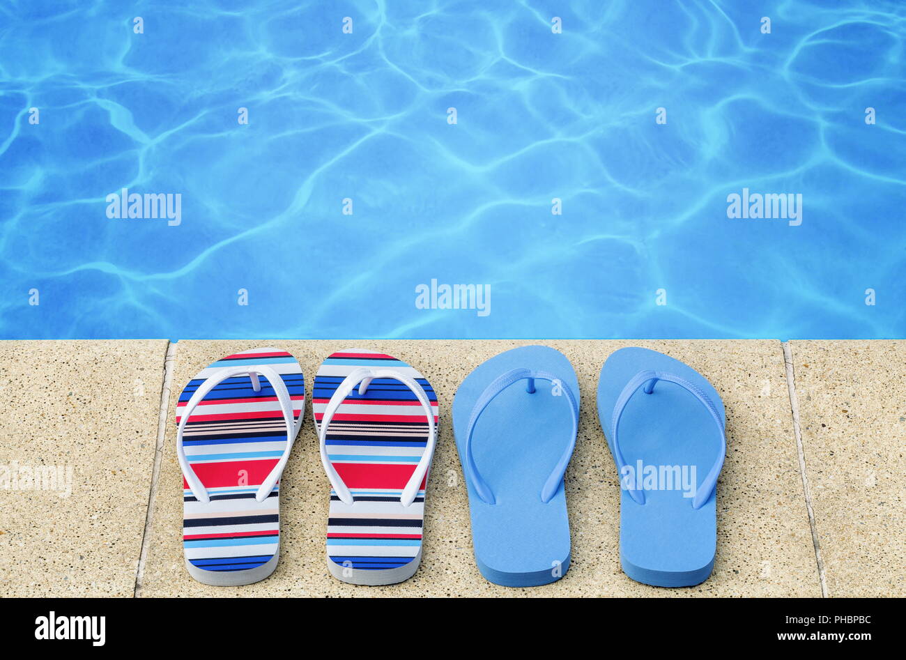 Flip flops near swimming pool Stock Photo - Alamy