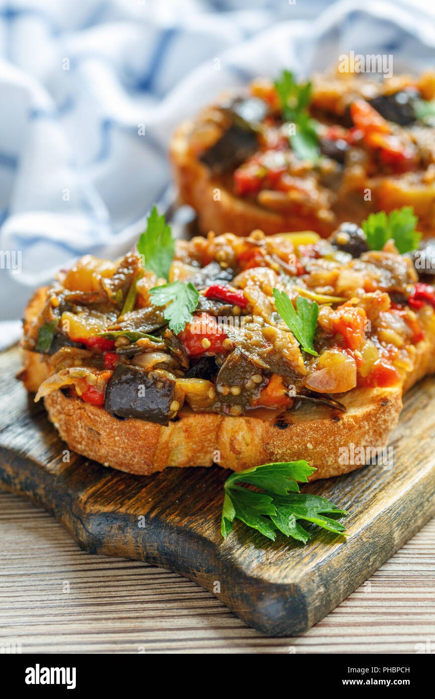Crostini from corn bread and baked vegetables Stock Photo - Alamy
