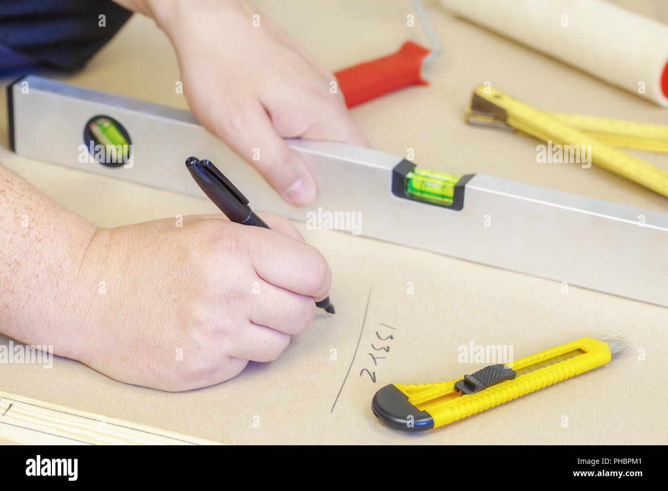 Worker writing hi-res stock photography and images - Alamy