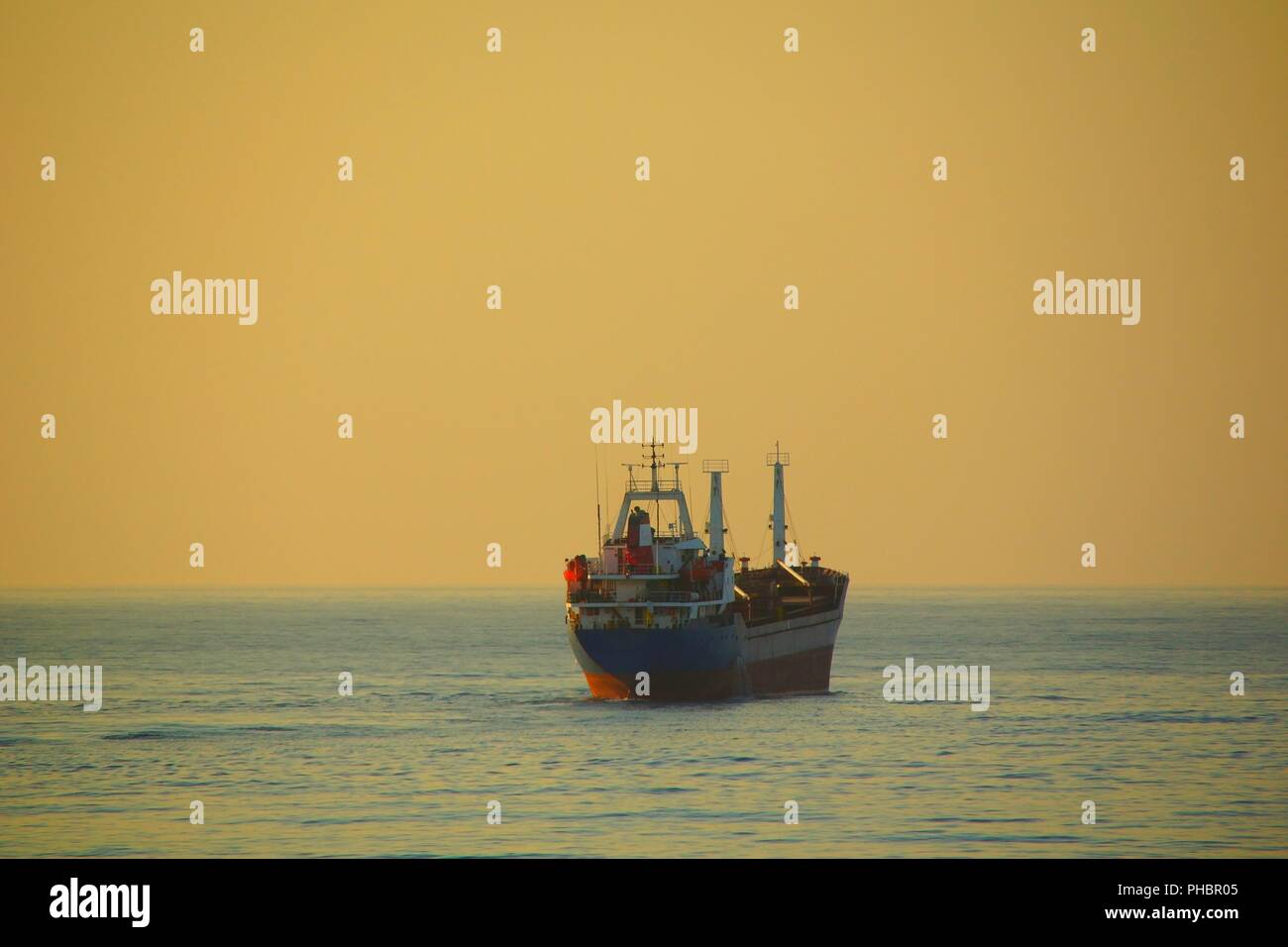 Ship departing from the port Stock Photo - Alamy