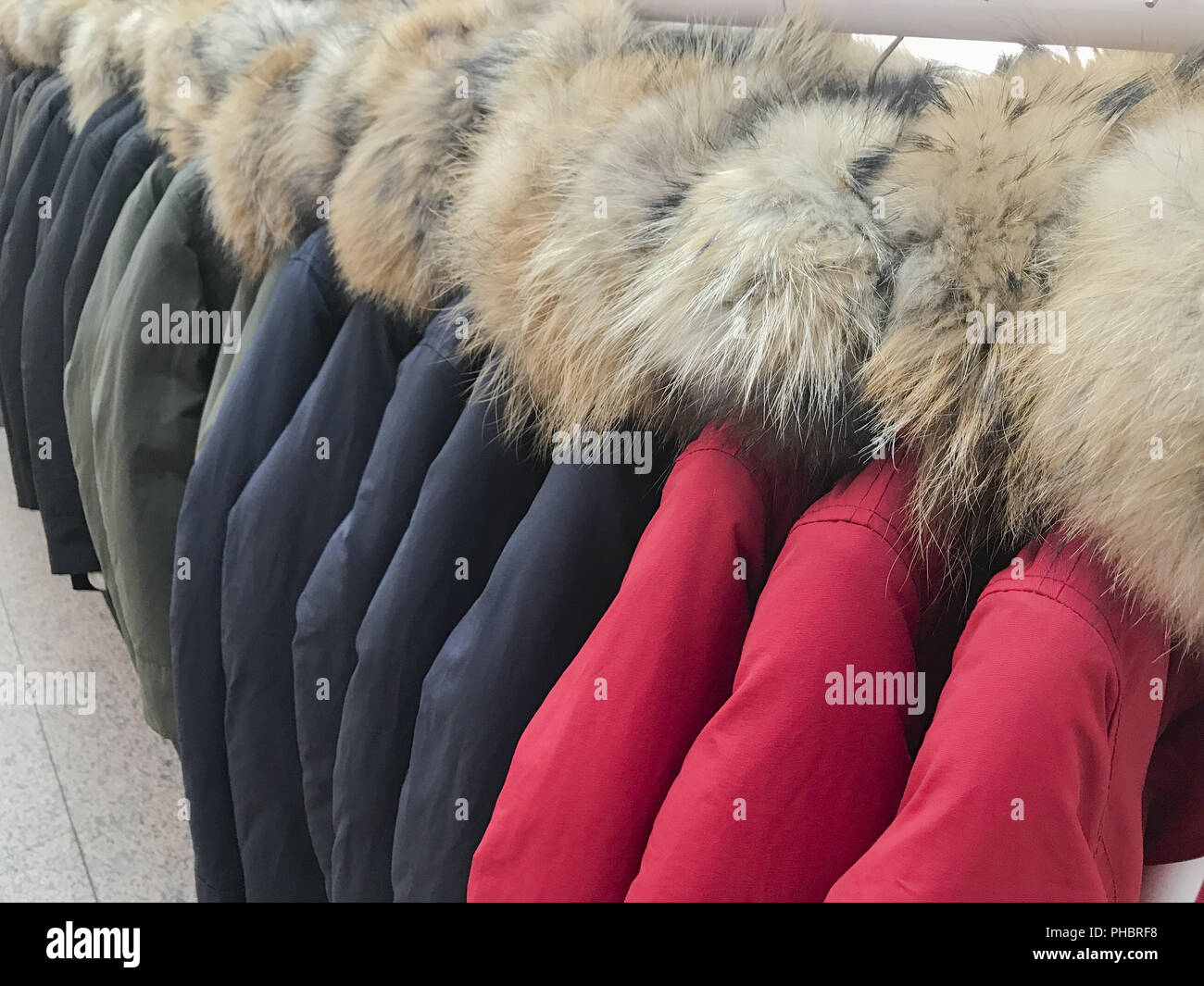 Winter Jacket in Winter Sale on a clothes rack Stock Photo - Alamy