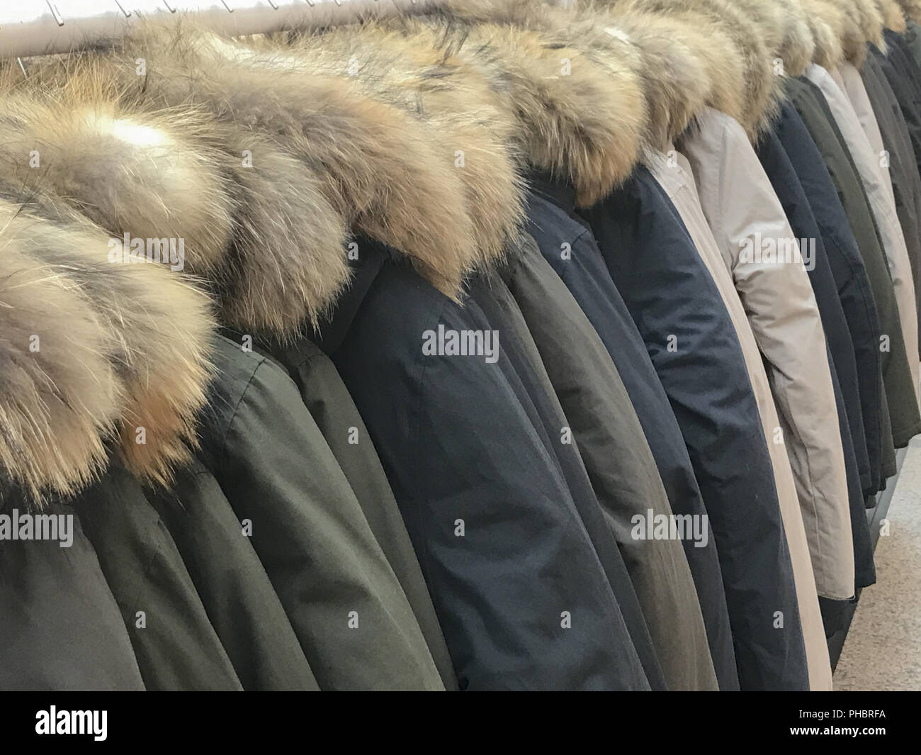 Winter Jacket in Winter Sale on a clothes rack Stock Photo - Alamy