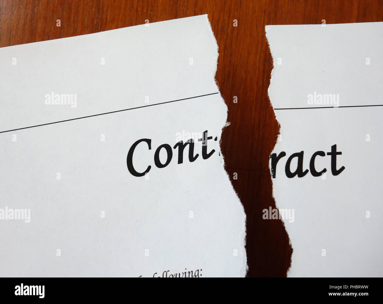 Contract torn in two Stock Photo - Alamy