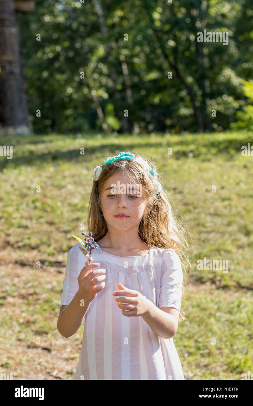 Cute little girl in the summer park Stock Photo - Alamy
