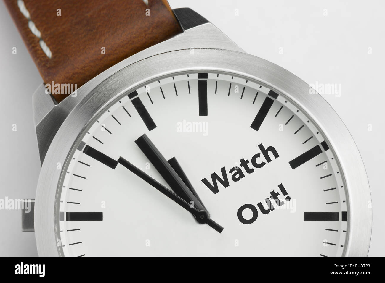 Watch with text Watch Out Stock Photo - Alamy