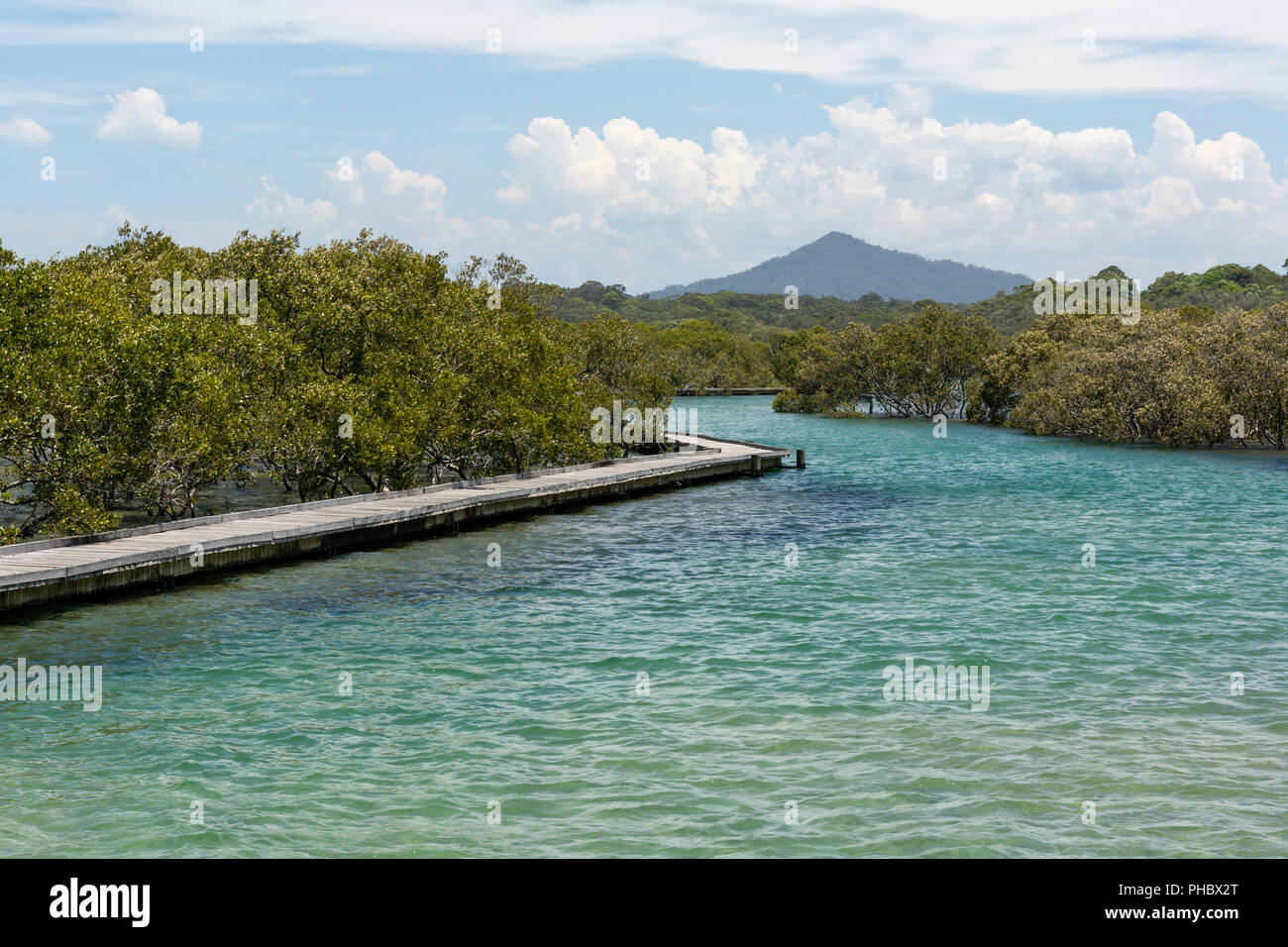 Ocean boardwalk in Urunga on the Coffs Coast with the hill of Nunguu ...