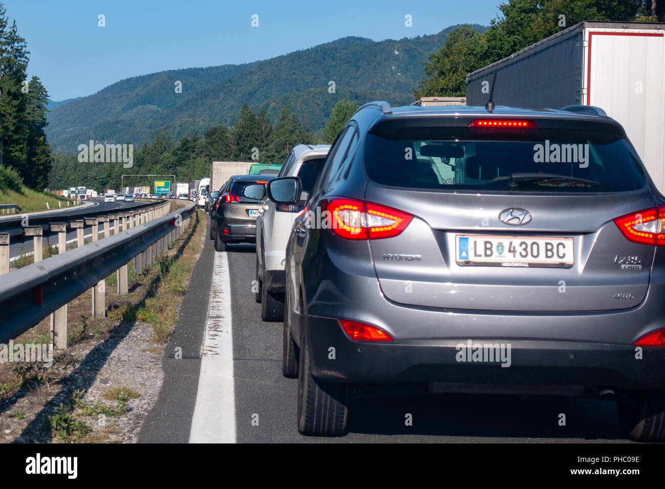 Traffic jam in the traffic by cars on highway street hi-res stock ...