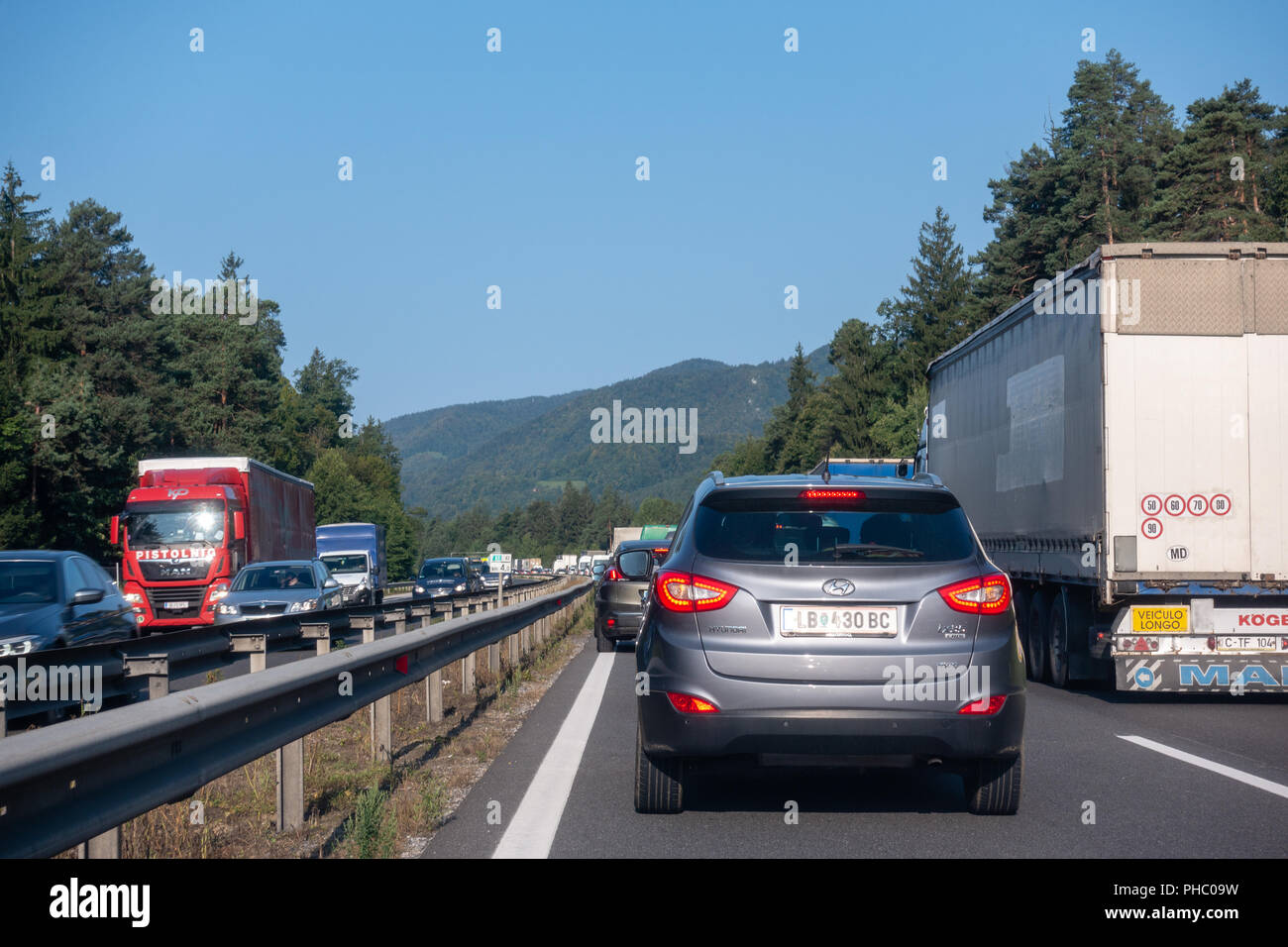 Cars standing still in lines on highway, a car accident caused traffic ...