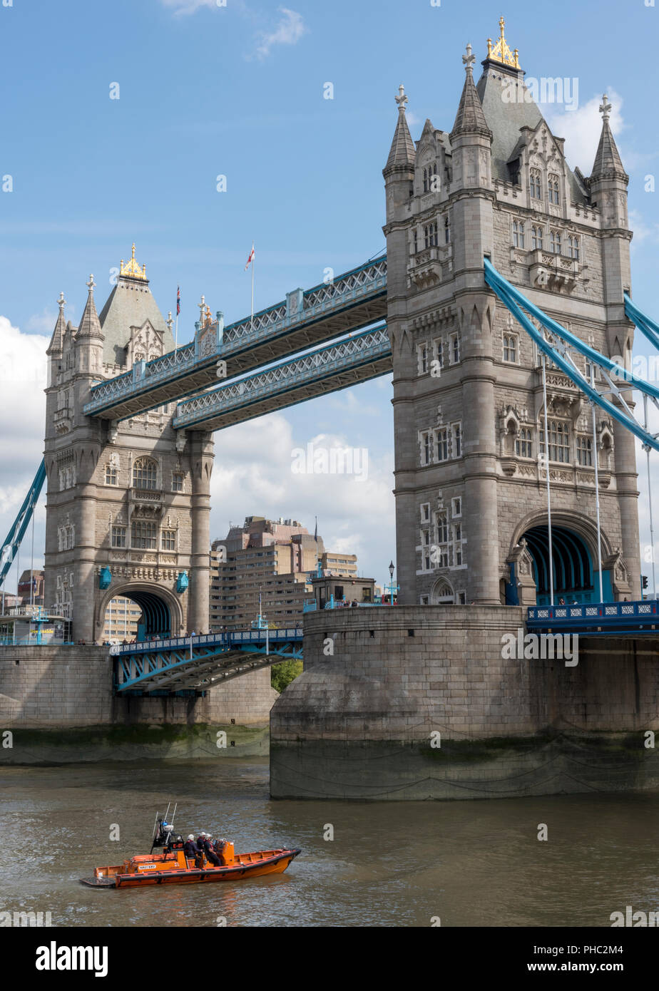 the london river thames lifeboat next to tower bridge in the centre of ...