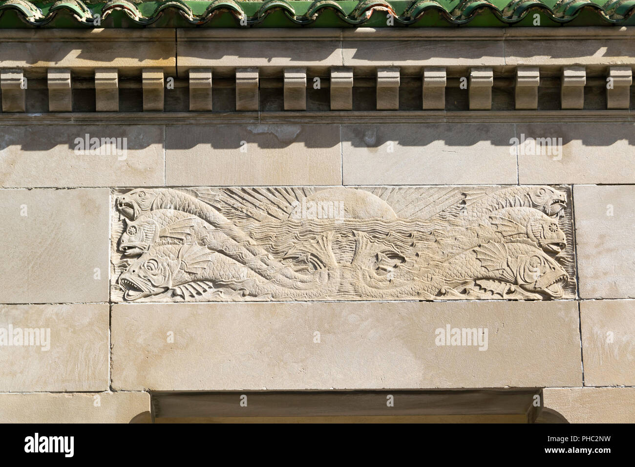Sun and fish sandstone relief at Boardwalk Hall Stock Photo - Alamy