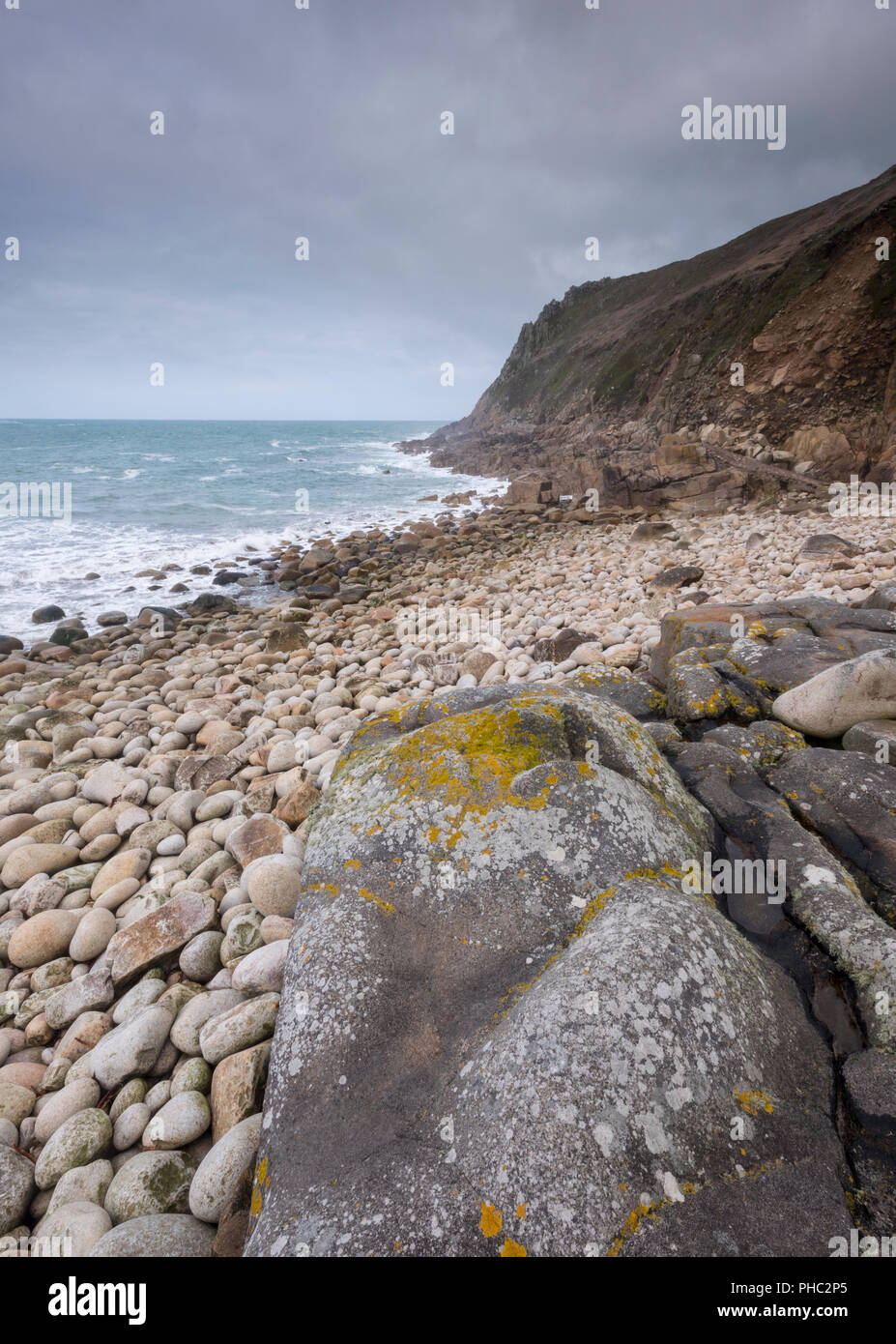 the beach and large pebbles at porth nanven in cornwall near penzance ...