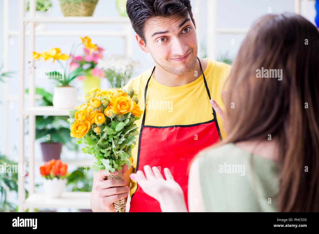Florist selling flowers in a flower shop Stock Photo - Alamy