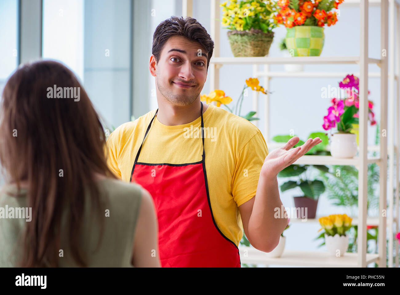 Florist selling flowers in a flower shop Stock Photo - Alamy