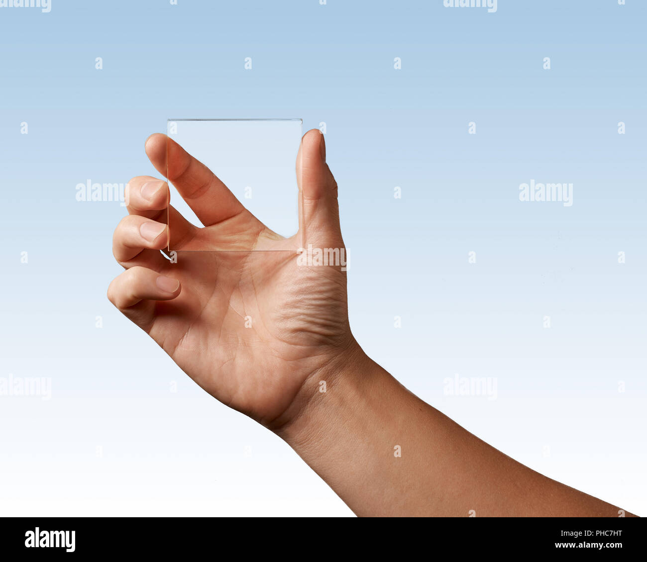 transparent glass represented in hand Stock Photo - Alamy