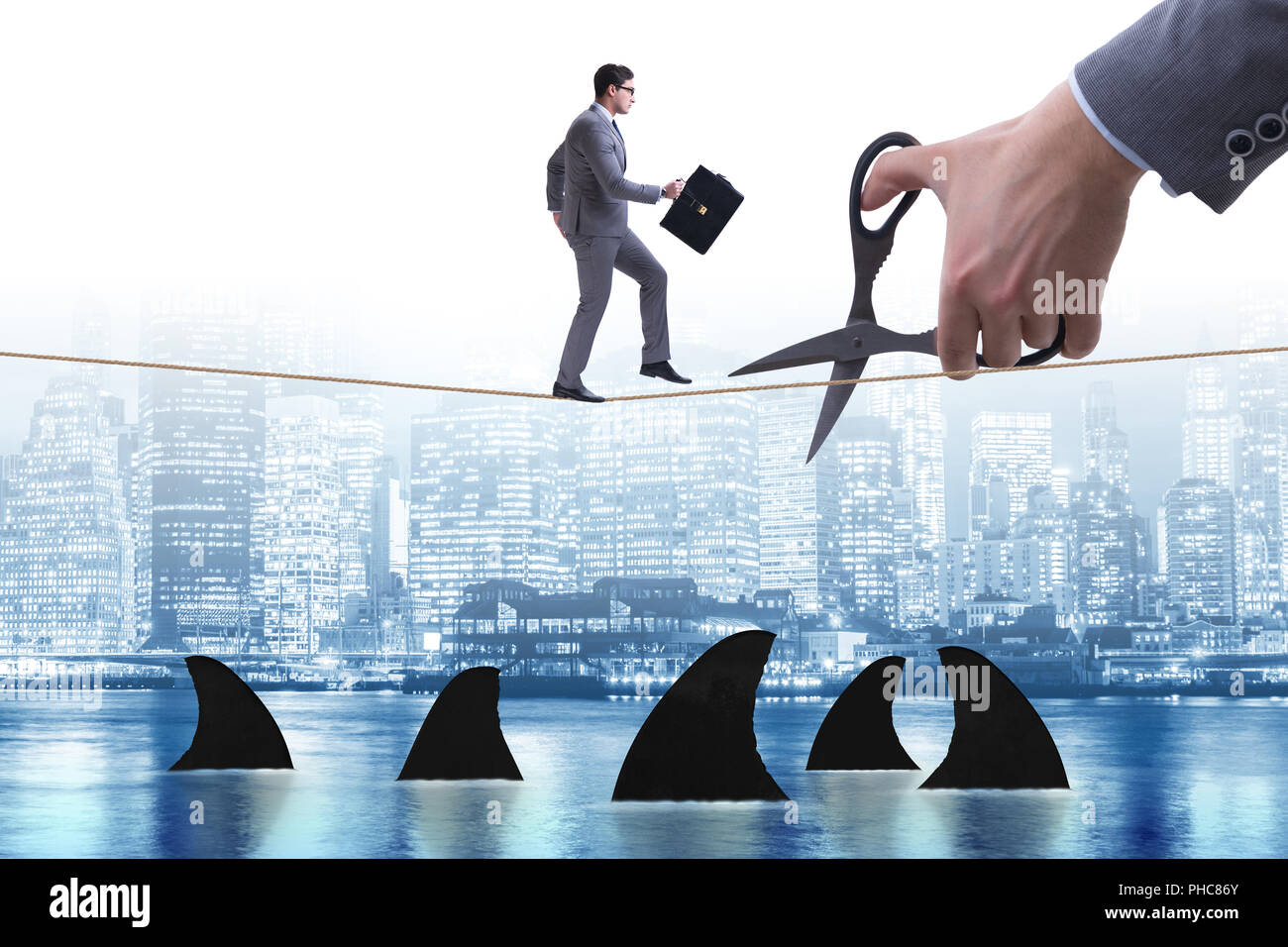 The hand cutting rope in business risk concept Stock Photo - Alamy