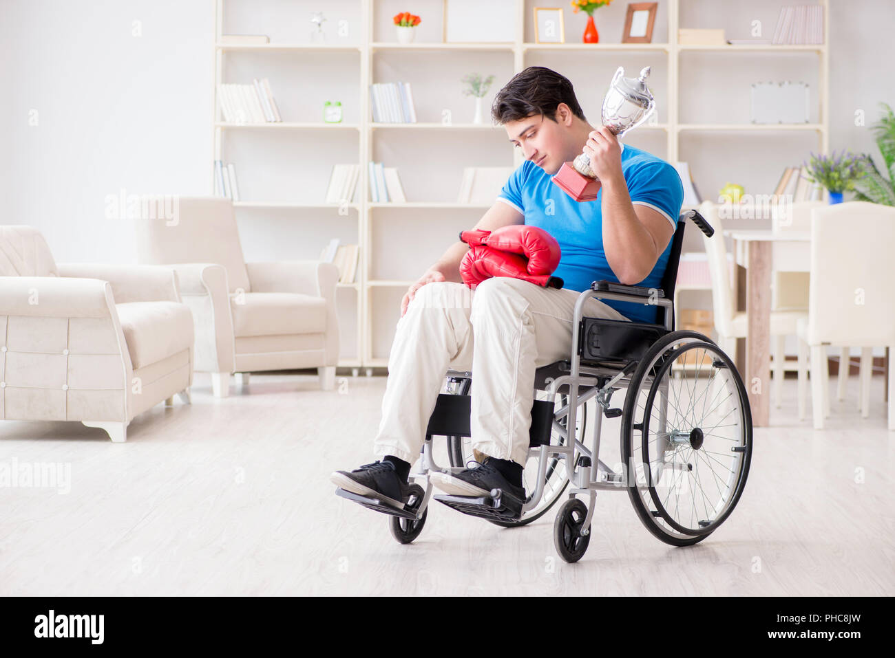 The disabled boxer at wheelchair recovering from injury Stock Photo - Alamy