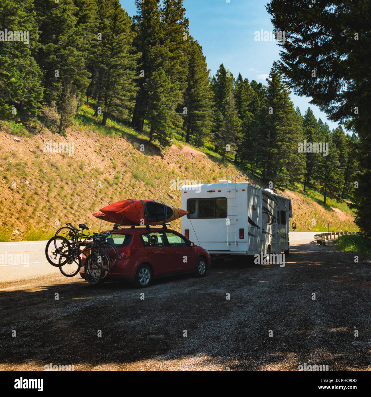 Motorhome, Red car, three kayaks and three bikes - Vacation time in RV ...