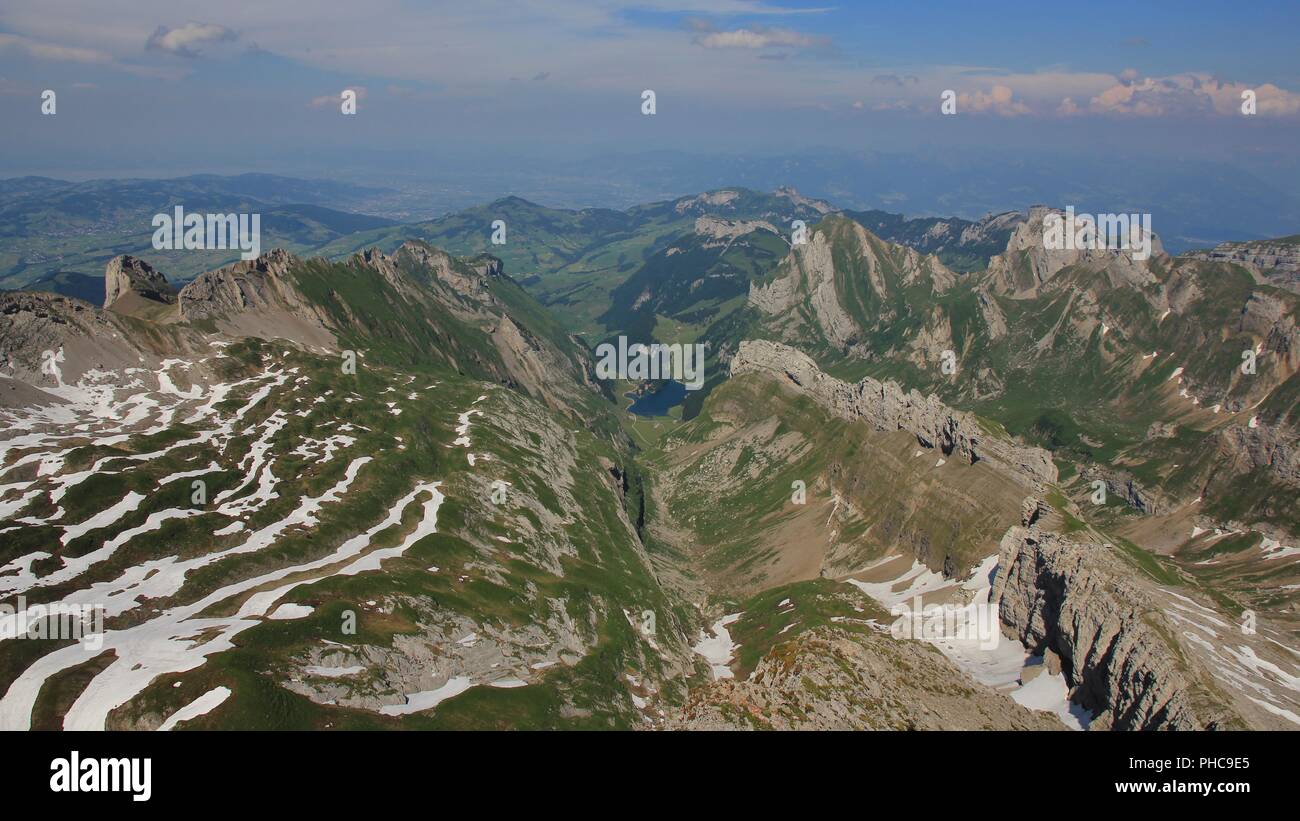 Mountains of the Alpstein Range in early summer. Lake Seealpsee Stock ...