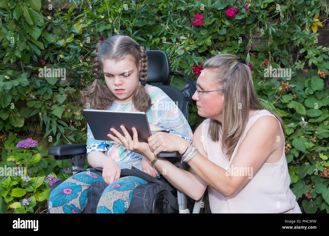 Disability, a disabled person with learning difficulties being cared ...