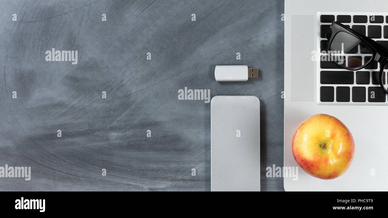 Back to school modern technology objects on erased chalkboard Stock ...