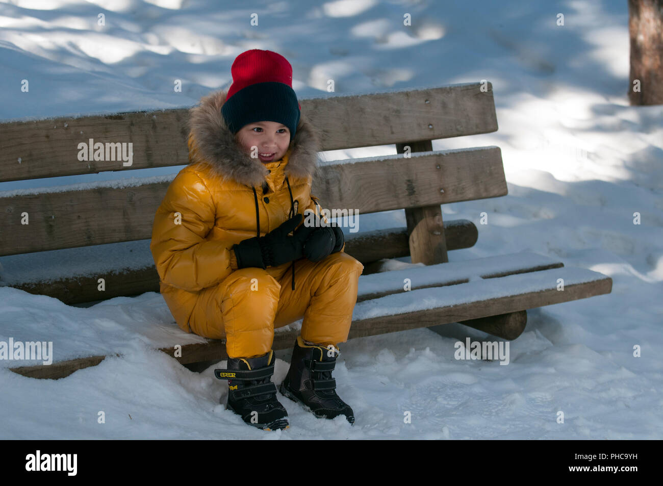 Boy sat on bench hi-res stock photography and images - Alamy