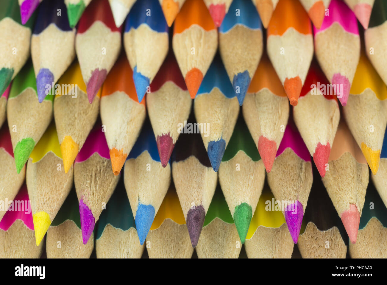 Wooden crayons as background picture Stock Photo - Alamy