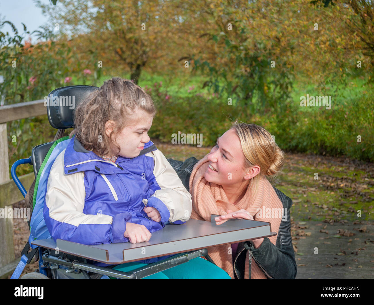 A disabled child being cared for by a special needs carer Stock Photo ...