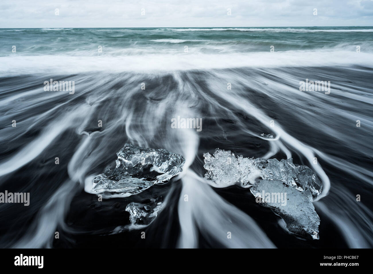 Icy beach in Iceland. Iceberg on the black volcanic sand on the ...