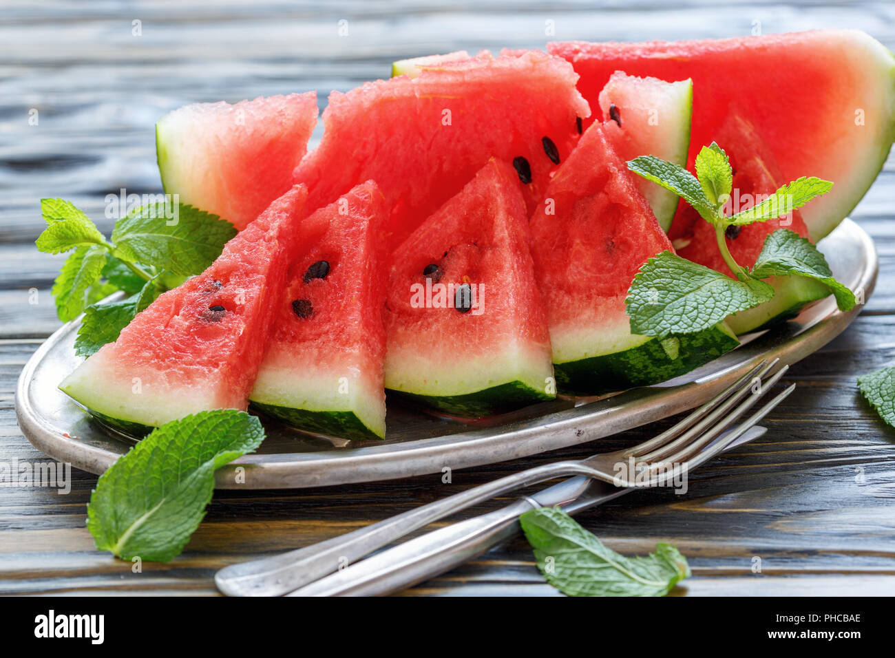 Watermelon slices on wooden hi-res stock photography and images - Alamy